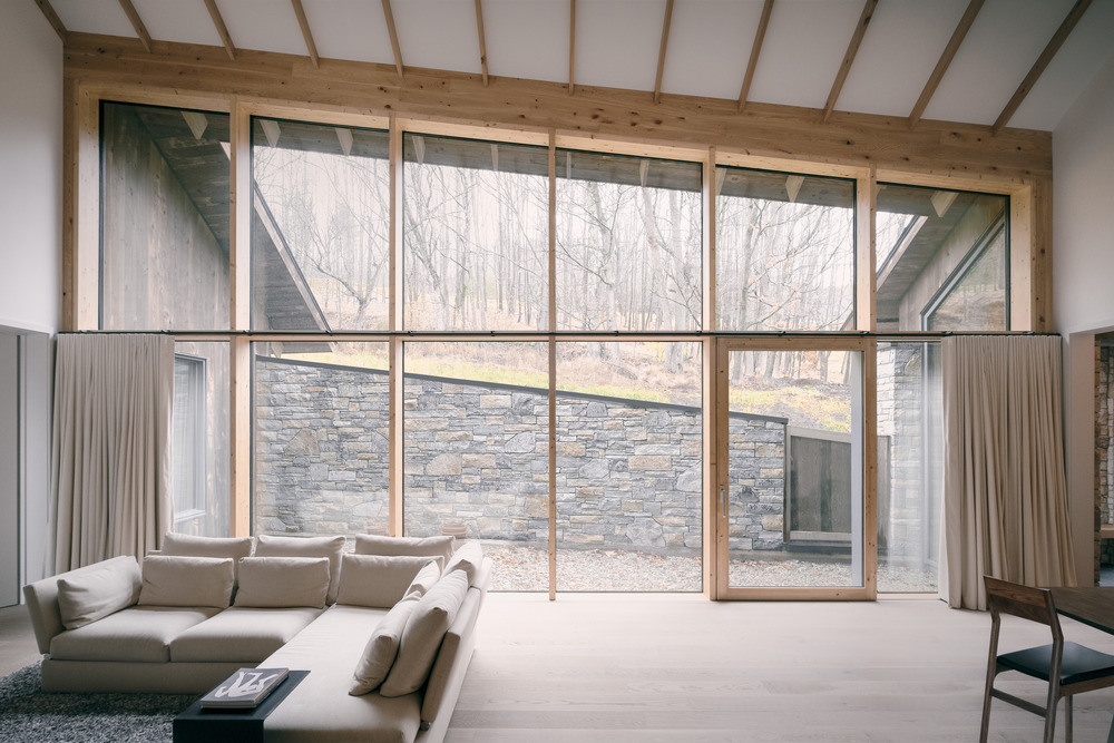 Quebec residence features fieldstone wall to meet structural/esthetic ...